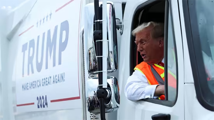 WATCH: Donald Trump wears garbage worker vest to rally in critical ...
